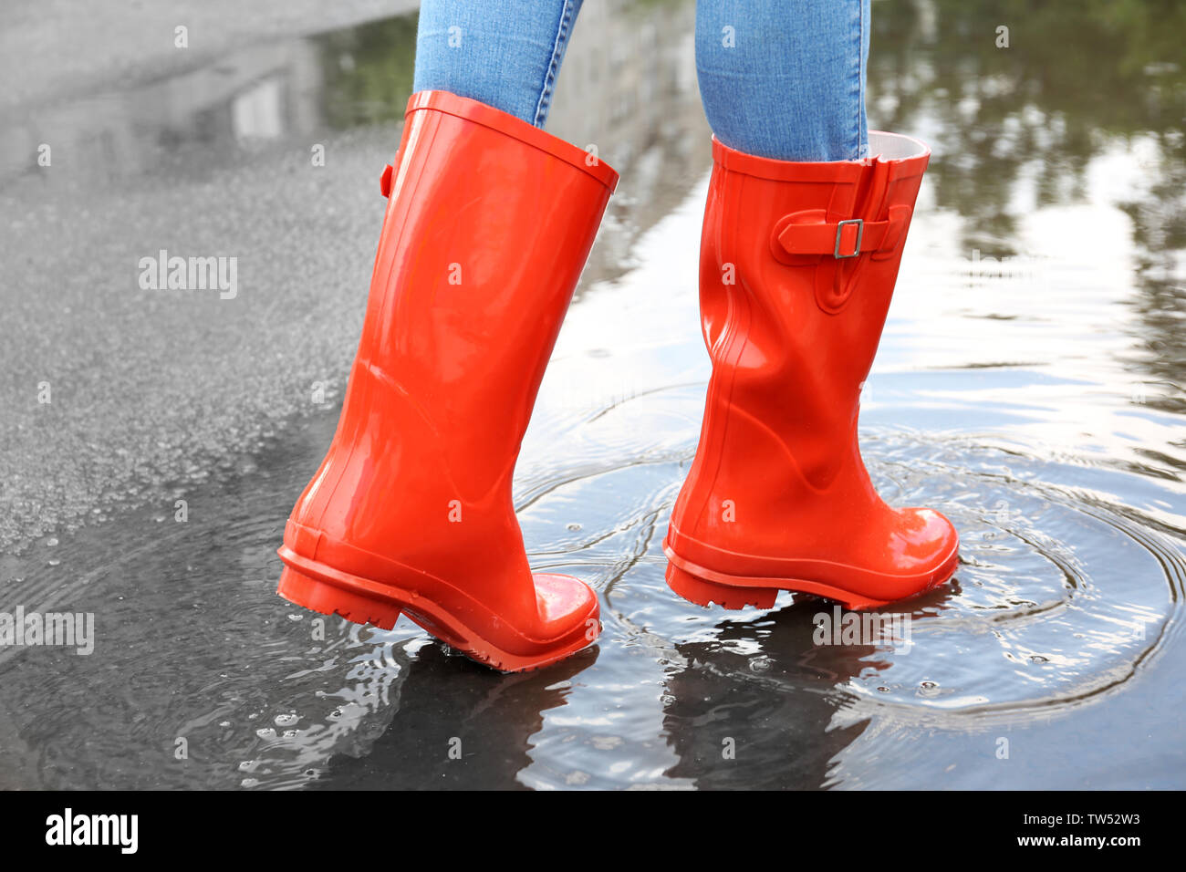 Woman in red rubber boots, outdoors Stock Photo - Alamy