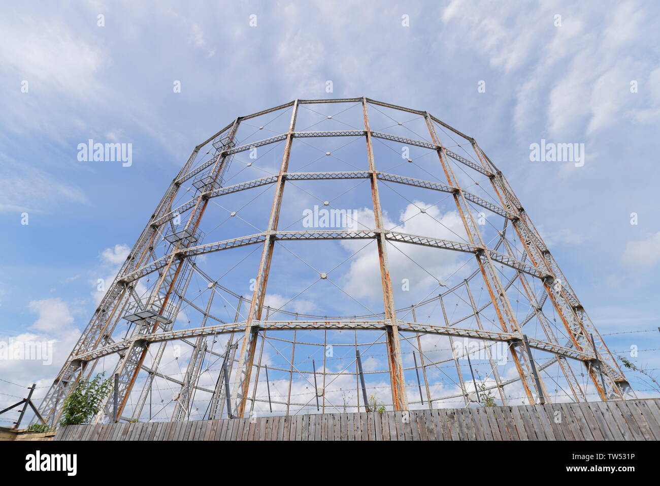 An empty Gasometer used for storing gas Stock Photo - Alamy