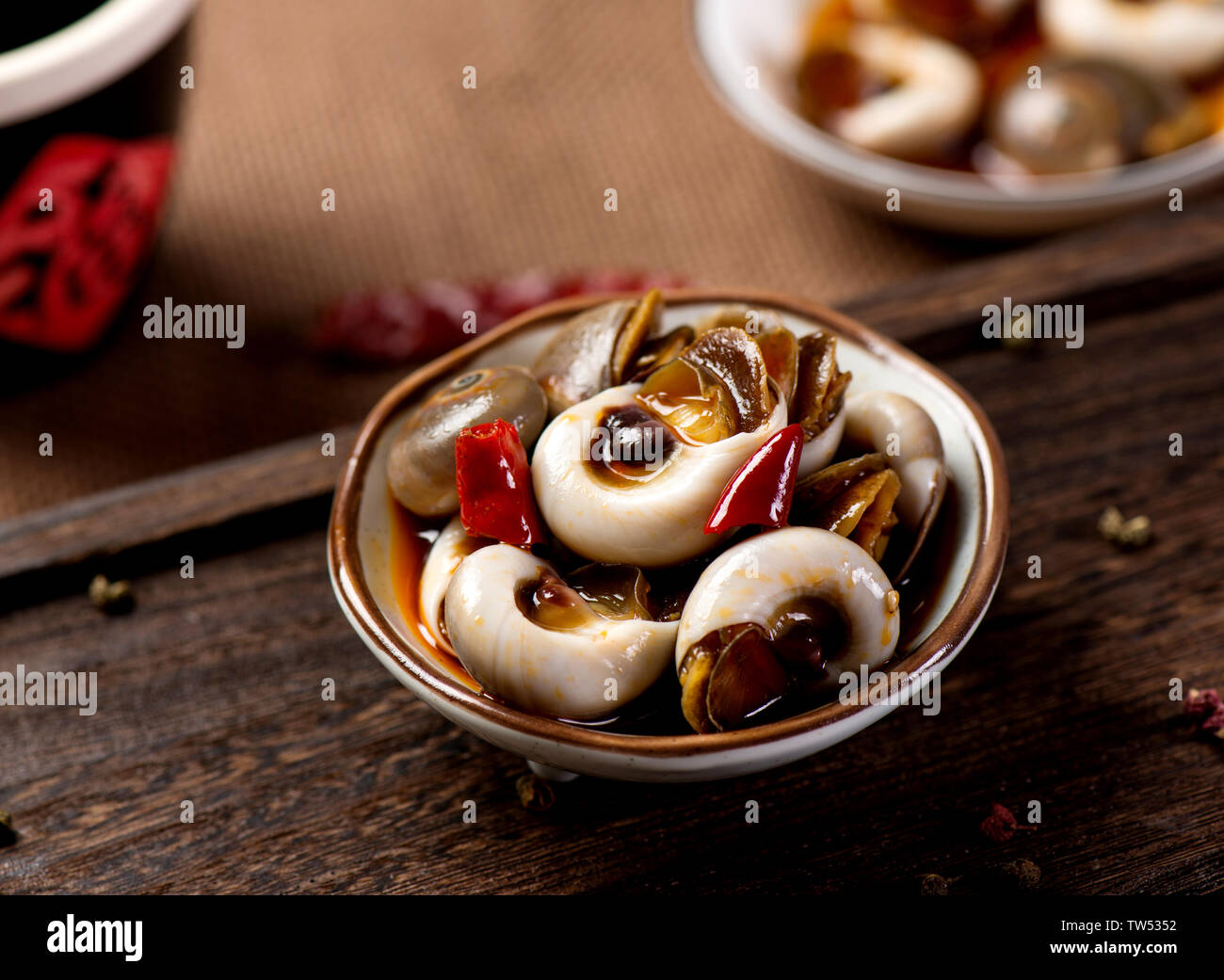Spicy little seafood snail Stock Photo - Alamy