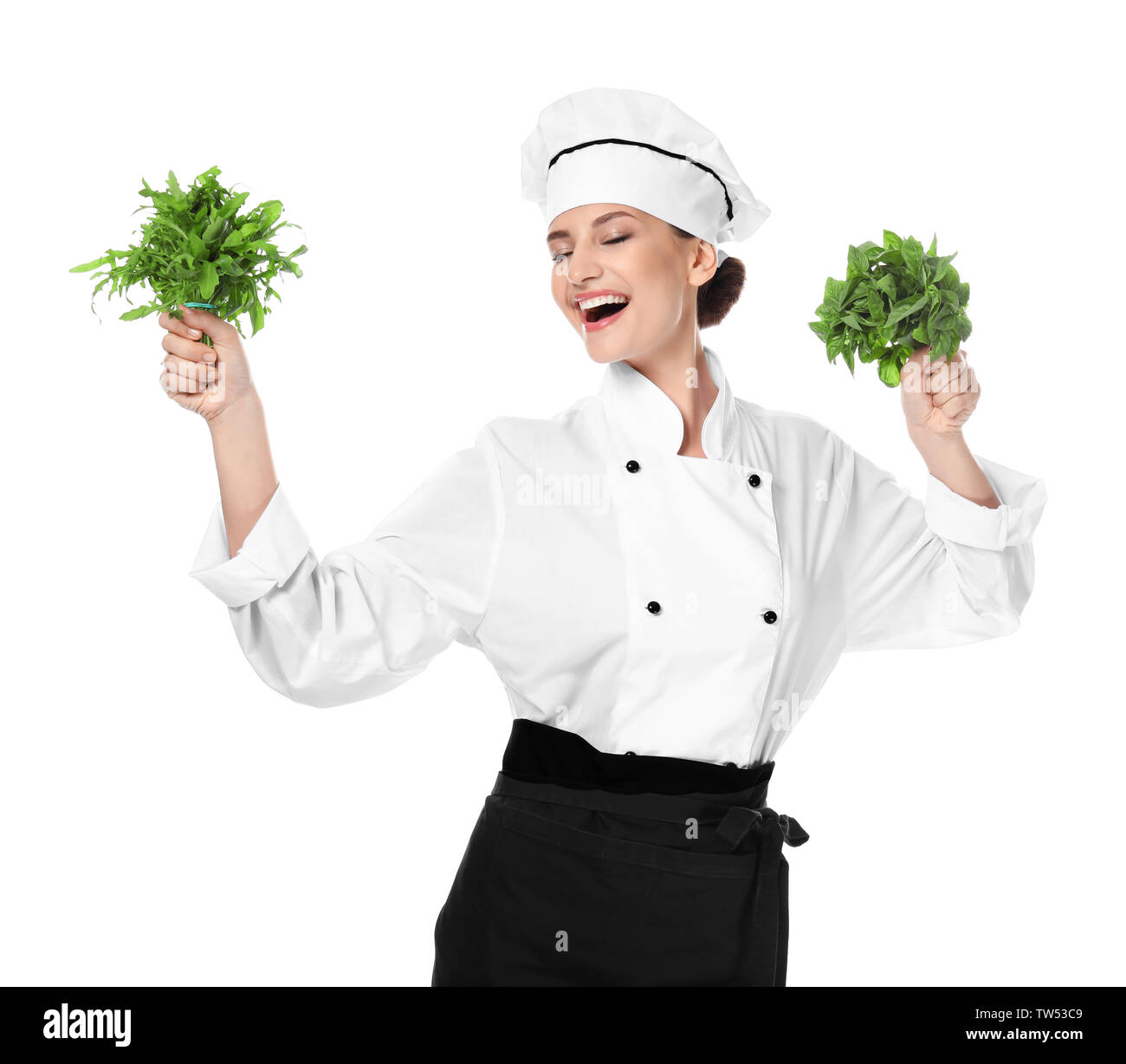Young female chef with herbs on white background Stock Photo - Alamy