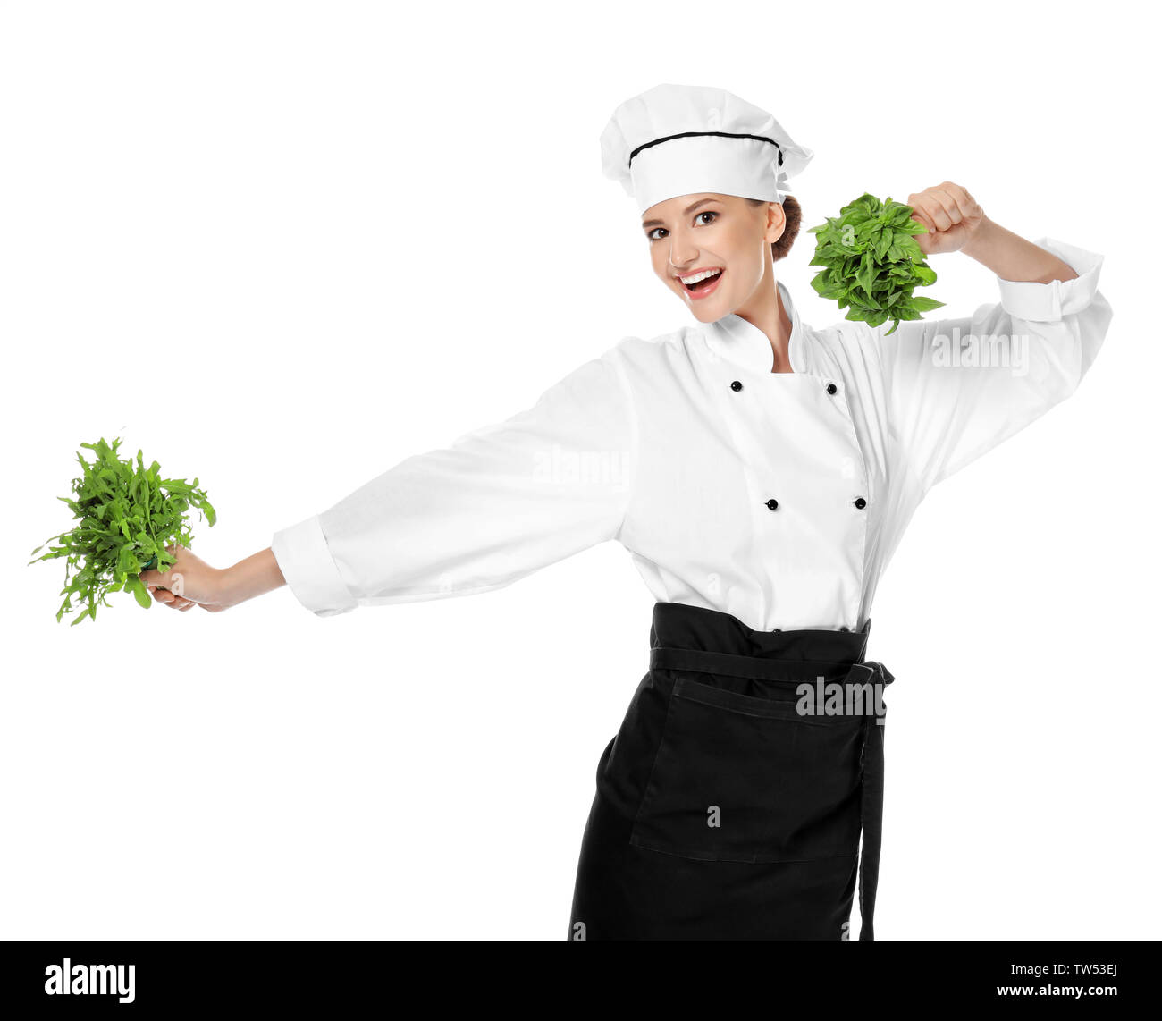 Young female chef with herbs on white background Stock Photo - Alamy