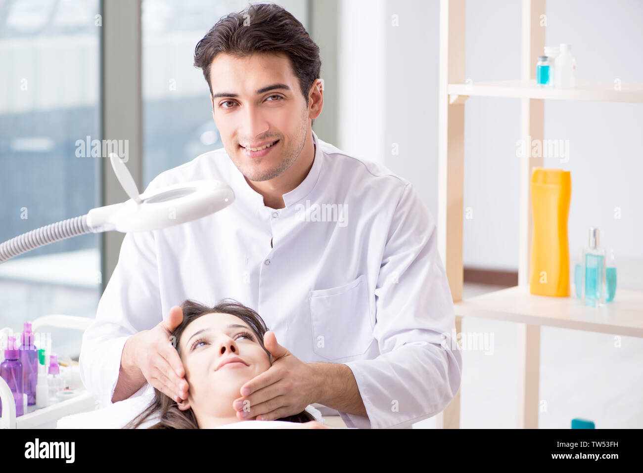 Young woman visiting male doctor cosmetologist Stock Photo - Alamy