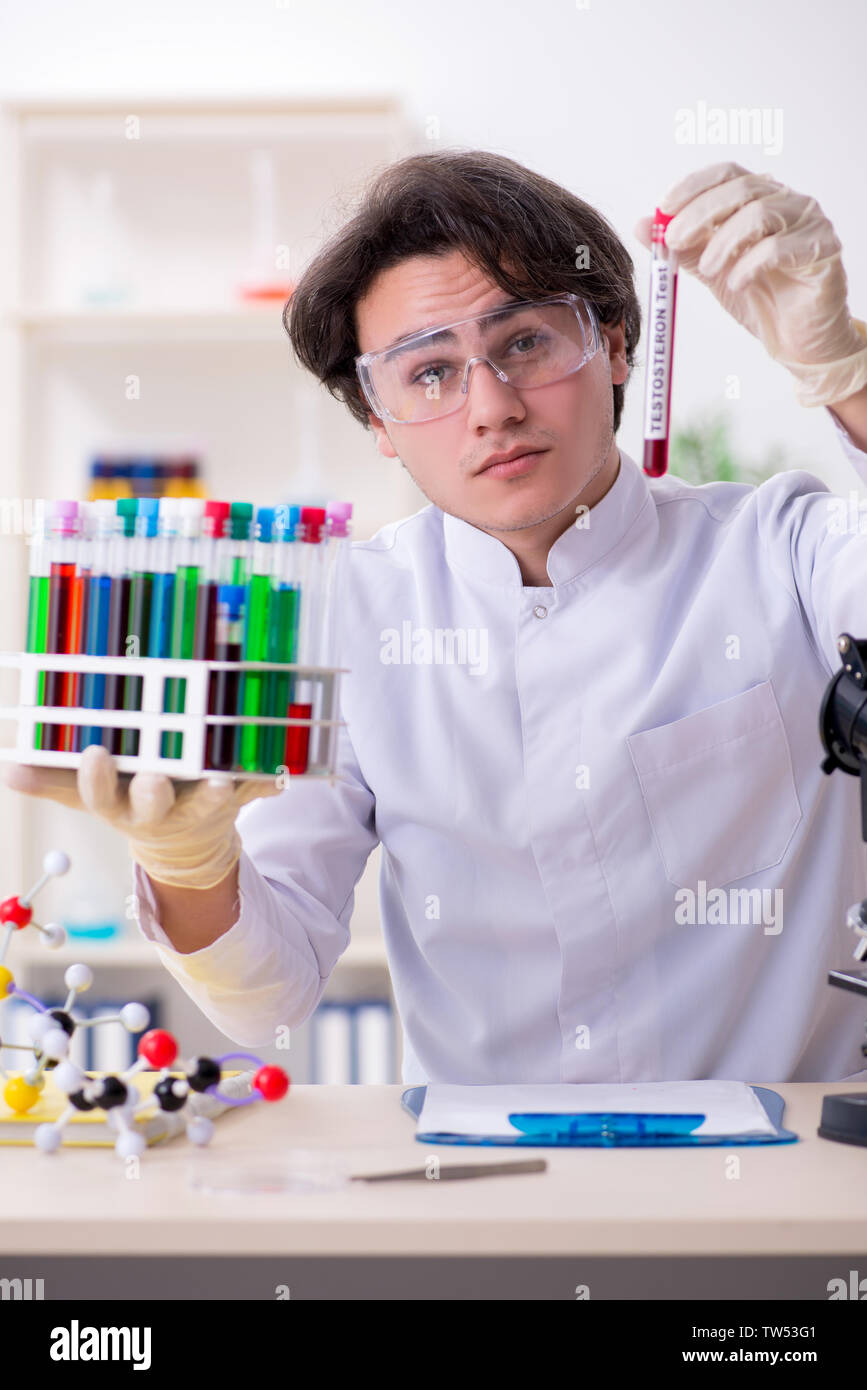 Young male biochemist working in the lab Stock Photo - Alamy