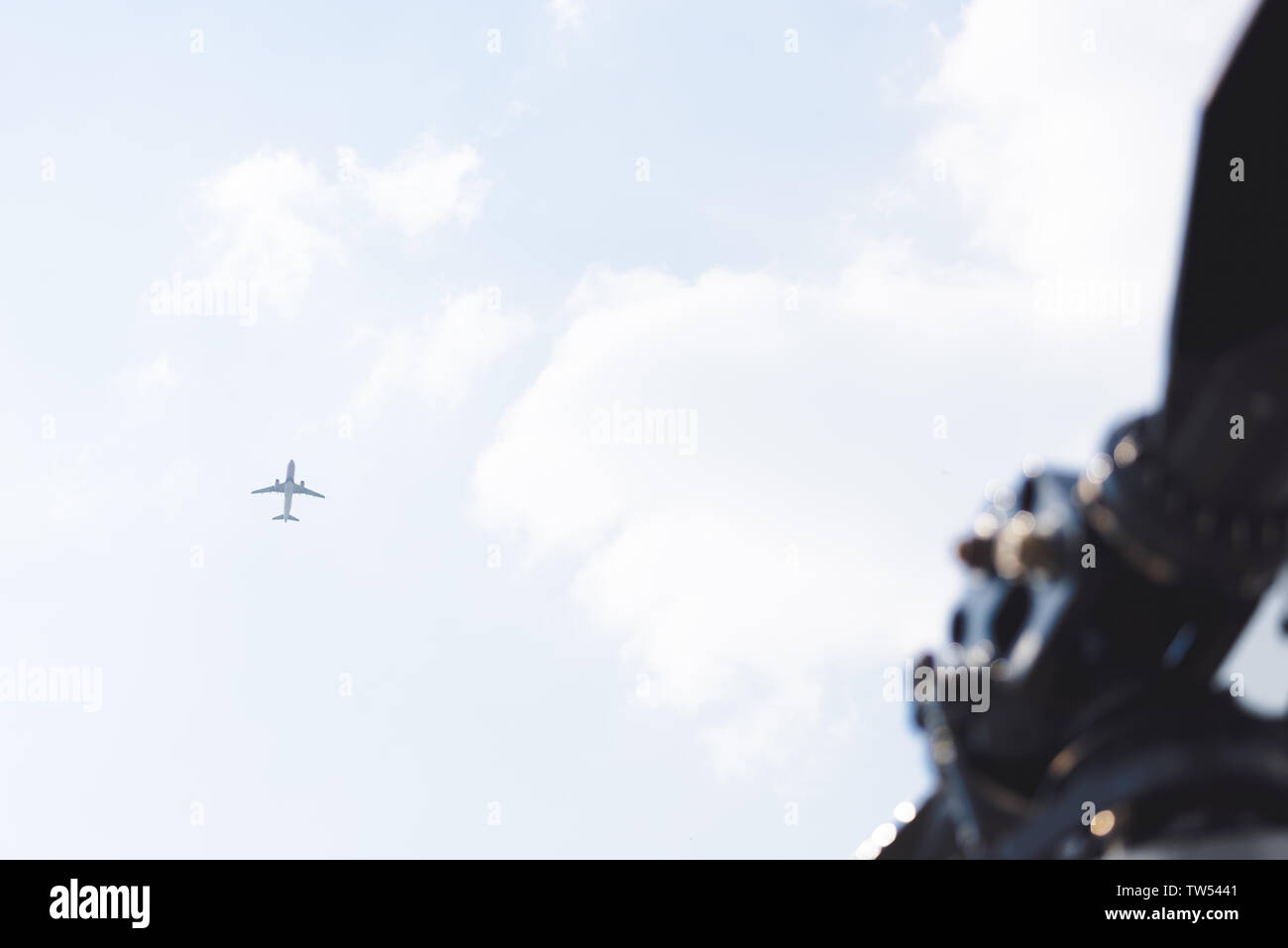 bottom view of plane flying in cloudy sky during daytime Stock Photo ...