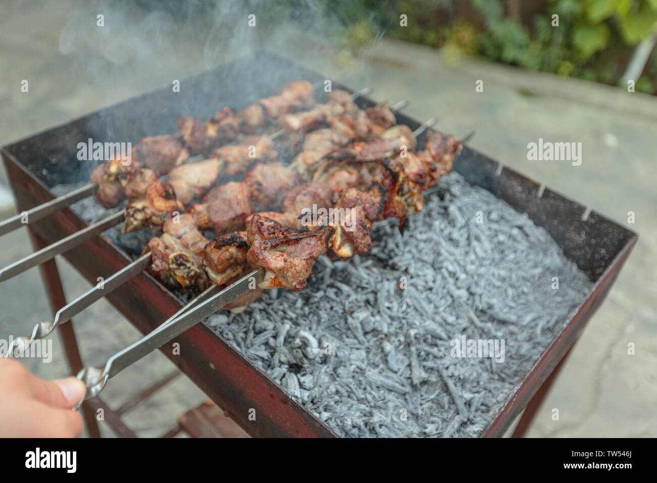 barbecue fried in the grill during the day Stock Photo - Alamy