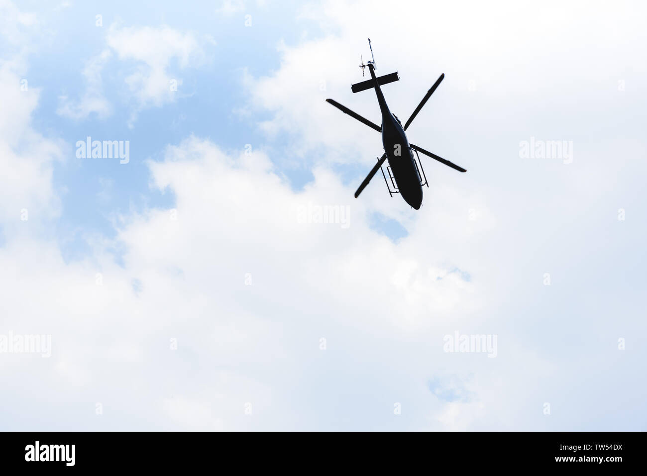 bottom view of helicopter flying in sky with copy space Stock Photo - Alamy