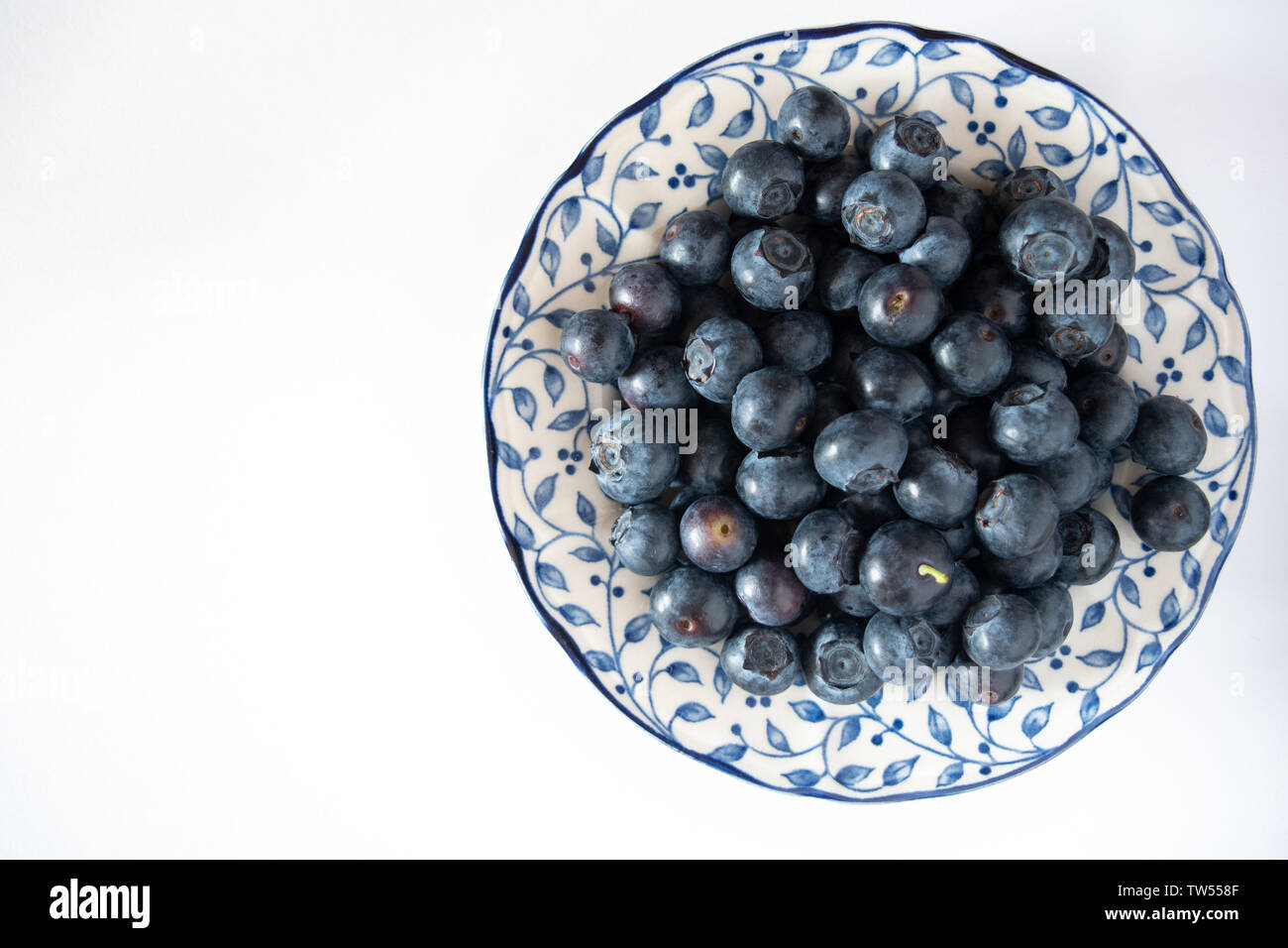 Fresh picked blueberries in a light and bright kitchen environment on a ...