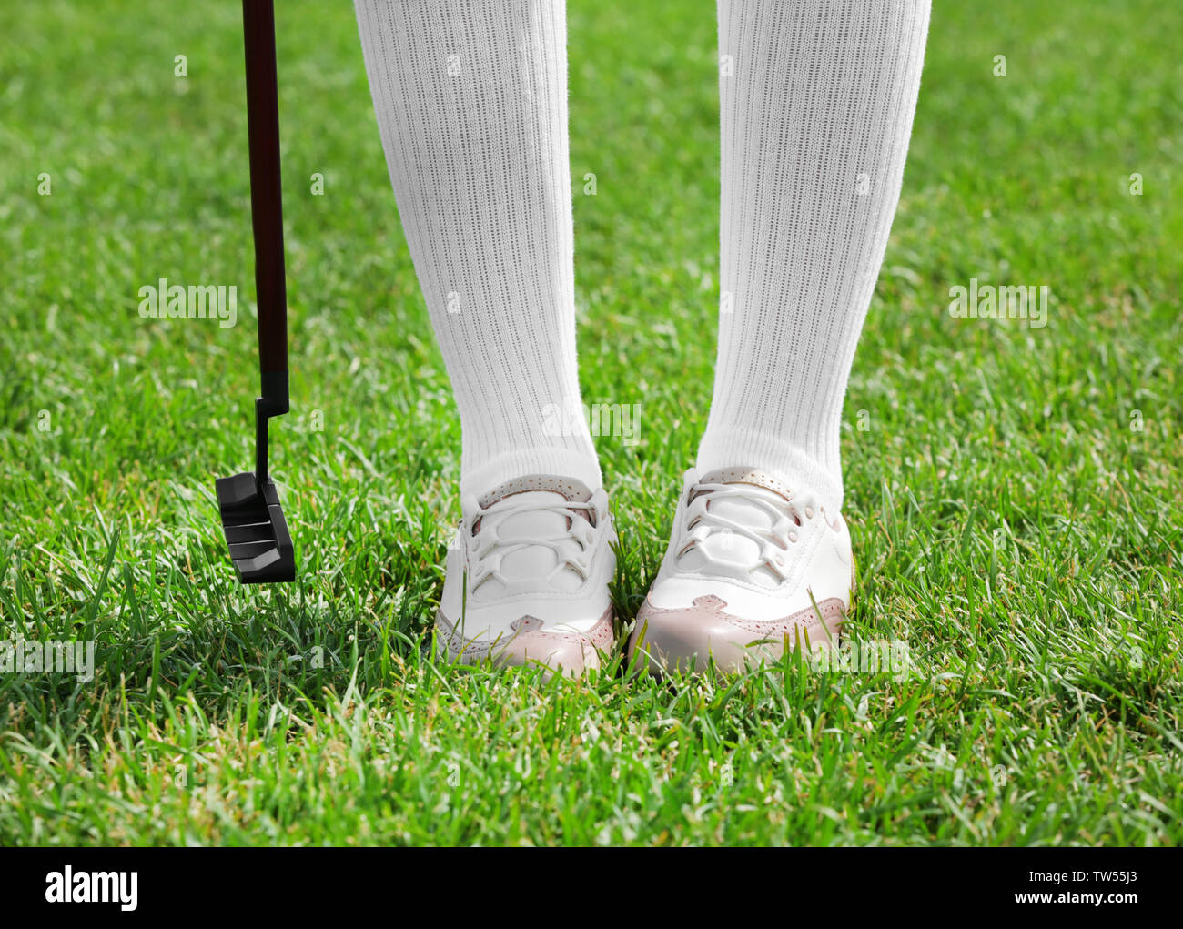 Legs of young golf player on course in summer day Stock Photo - Alamy