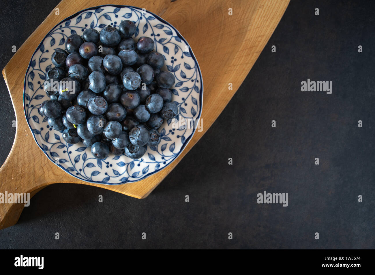 Fresh picked blueberries in a light and bright kitchen environment ...