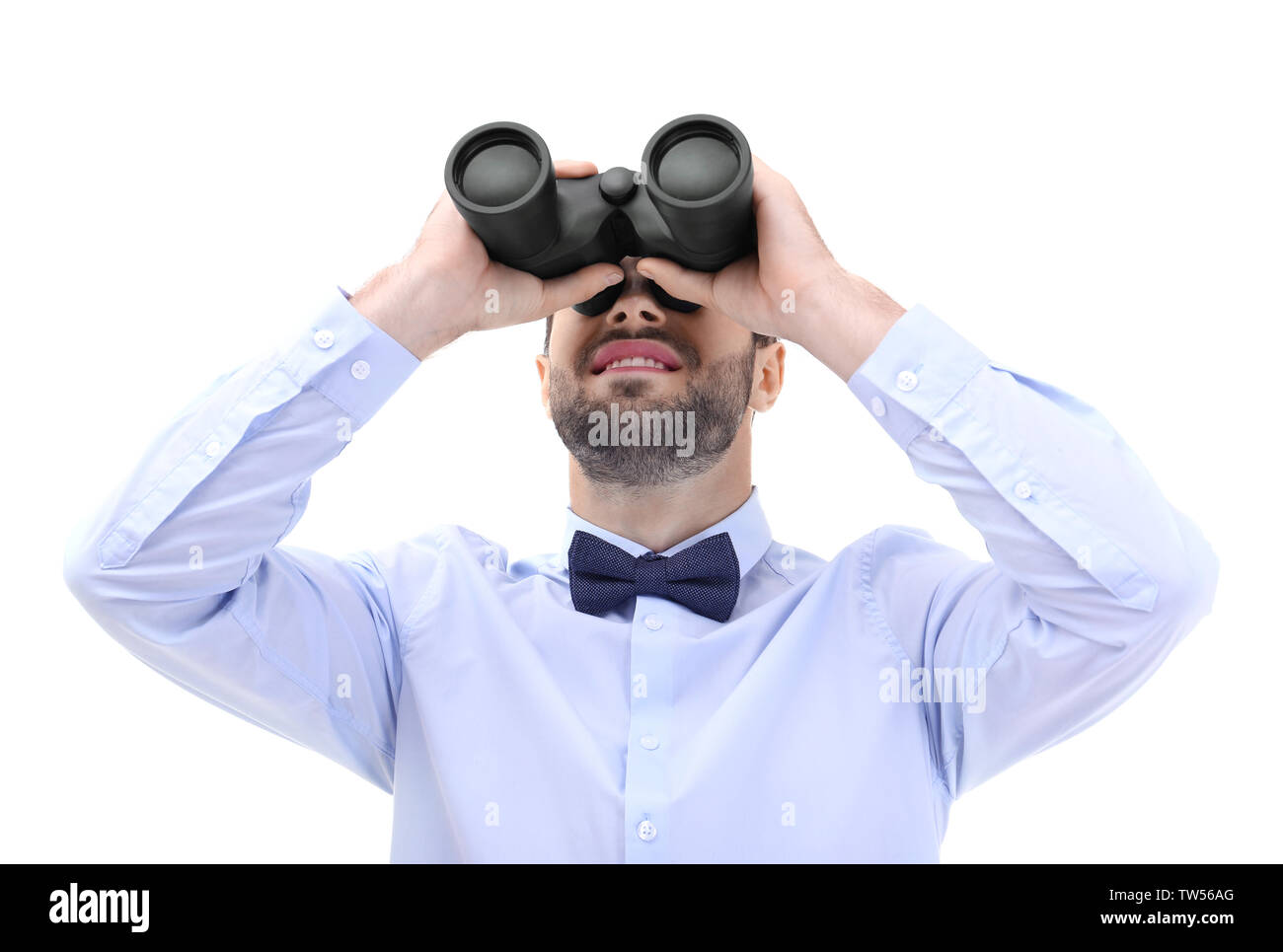Handsome young man with binocular on white background Stock Photo - Alamy