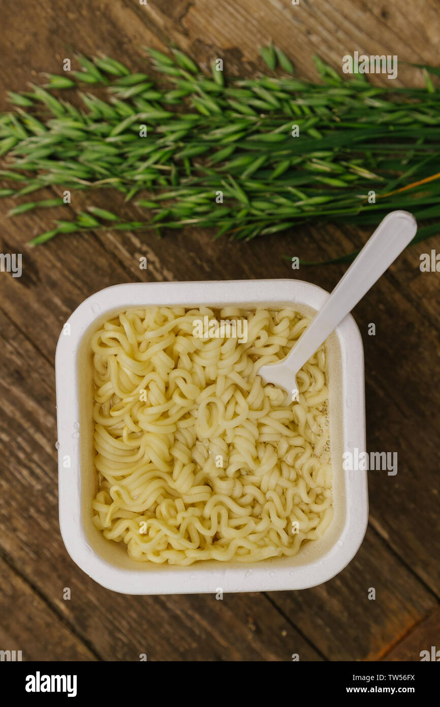 instant noodles on an old wooden table top view Stock Photo - Alamy