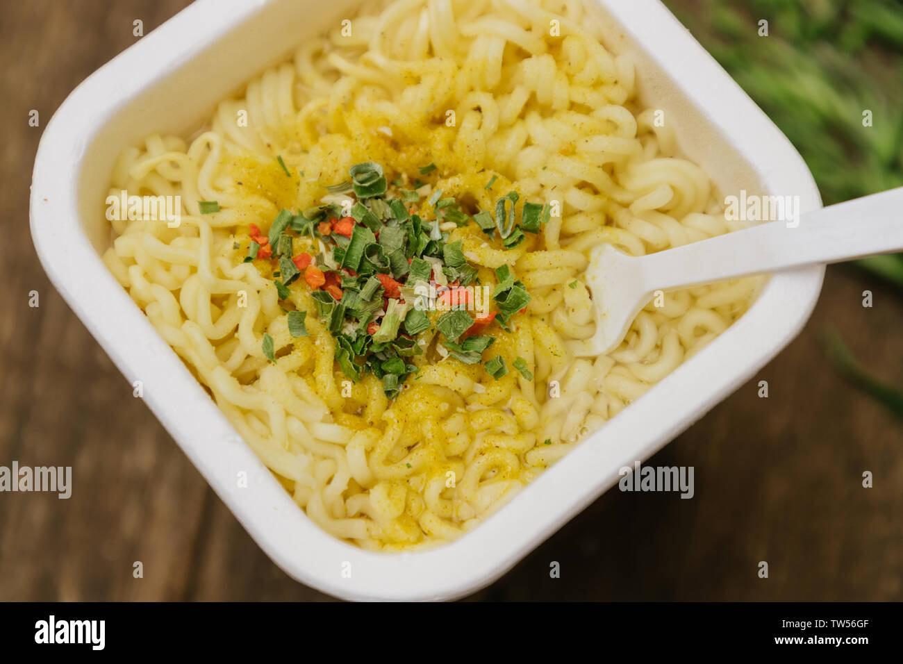 instant noodles on an old wooden table top view Stock Photo - Alamy