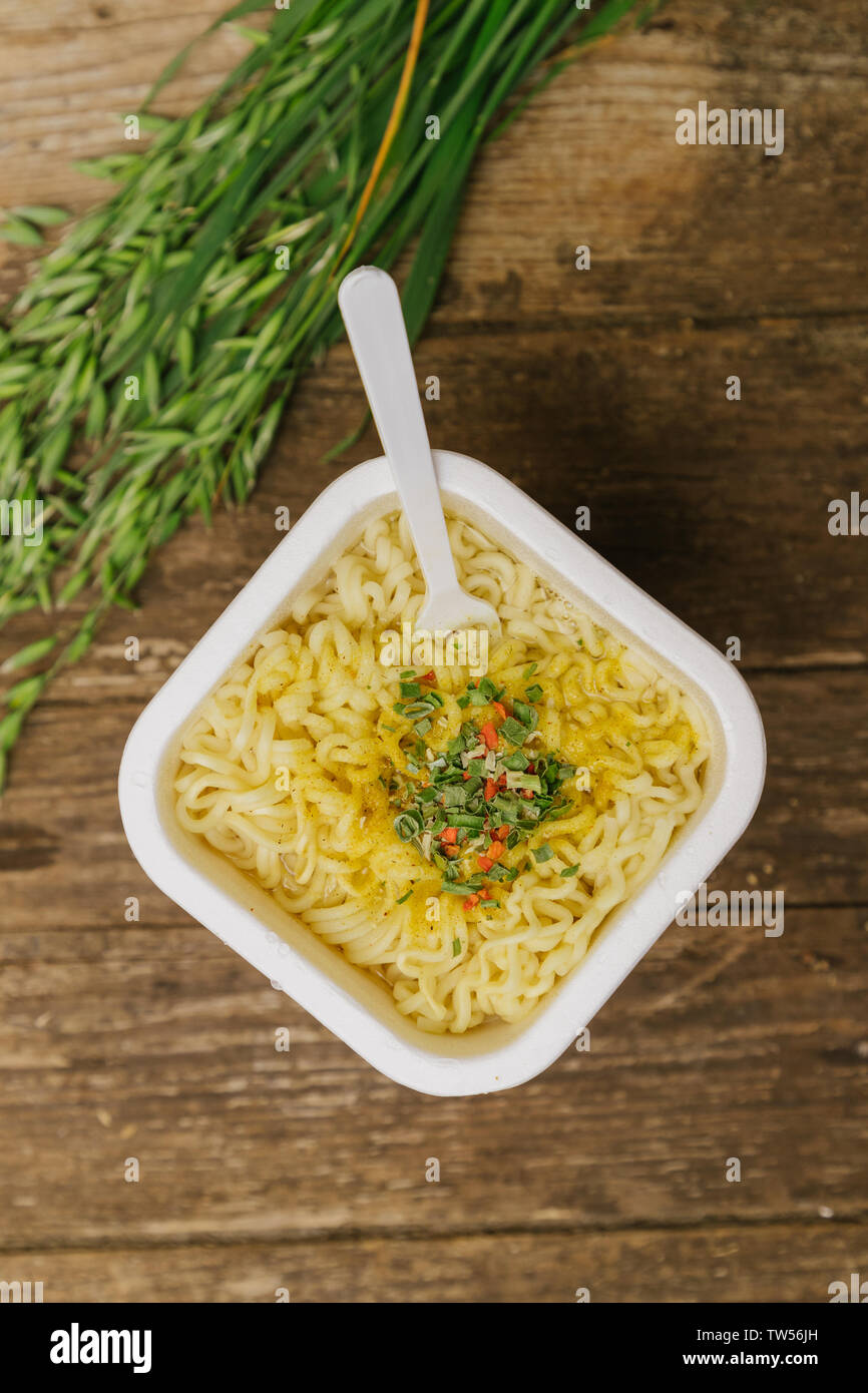 instant noodles on an old wooden table top view Stock Photo - Alamy