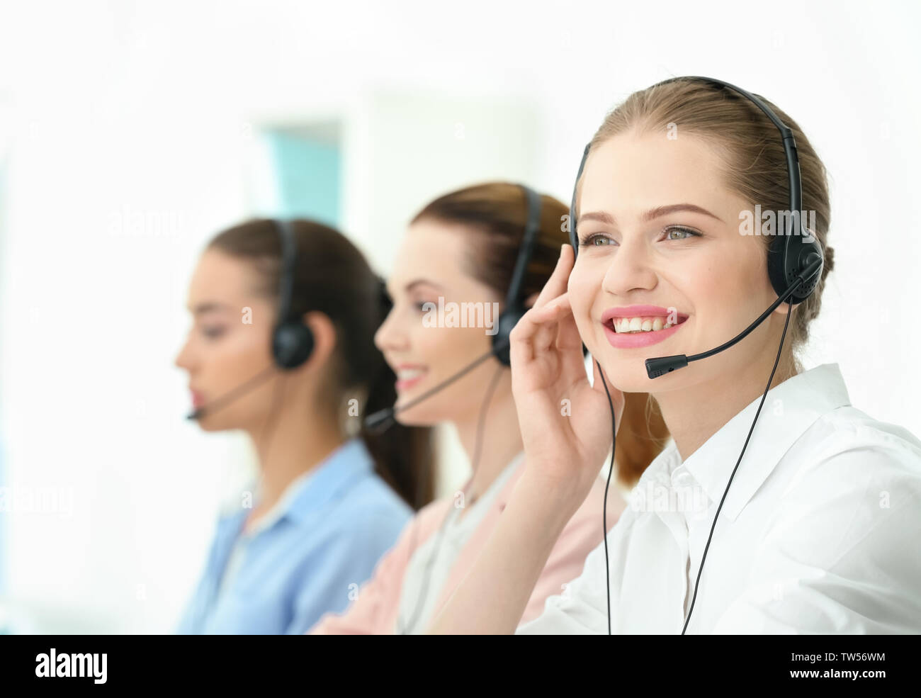 Young female technical support dispatchers working in office Stock ...