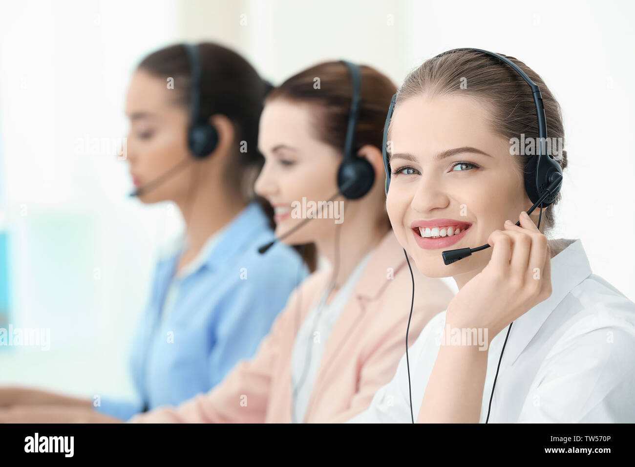 Young female technical support dispatchers working in office Stock ...