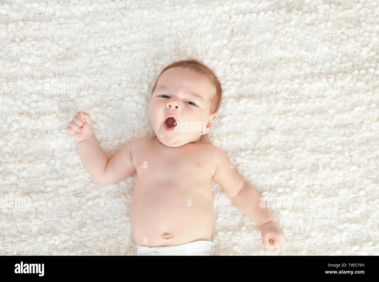 Cute little baby lying on soft plaid Stock Photo - Alamy