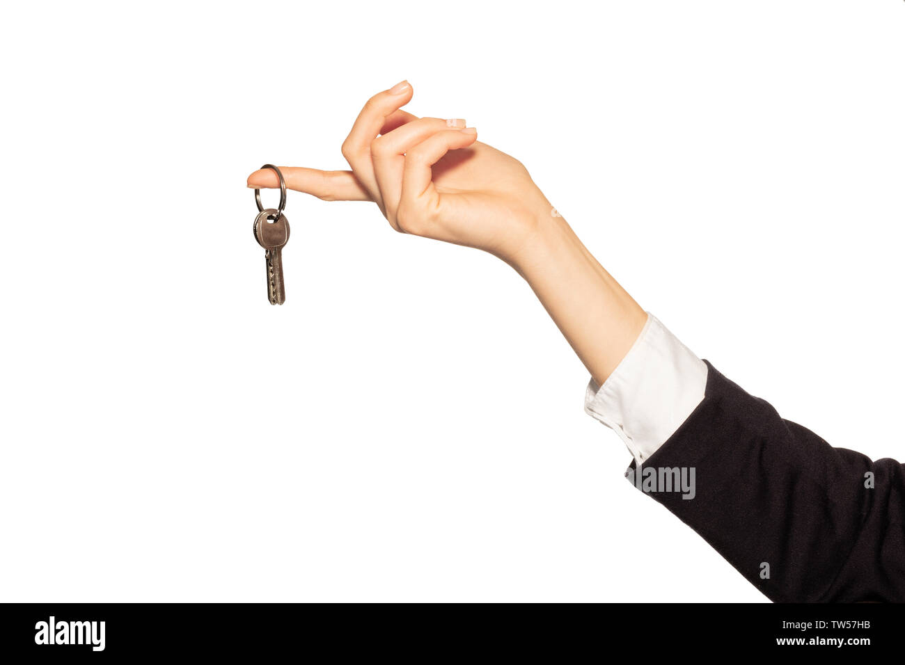 Female hand with door keys hanging on the finger Stock Photo - Alamy