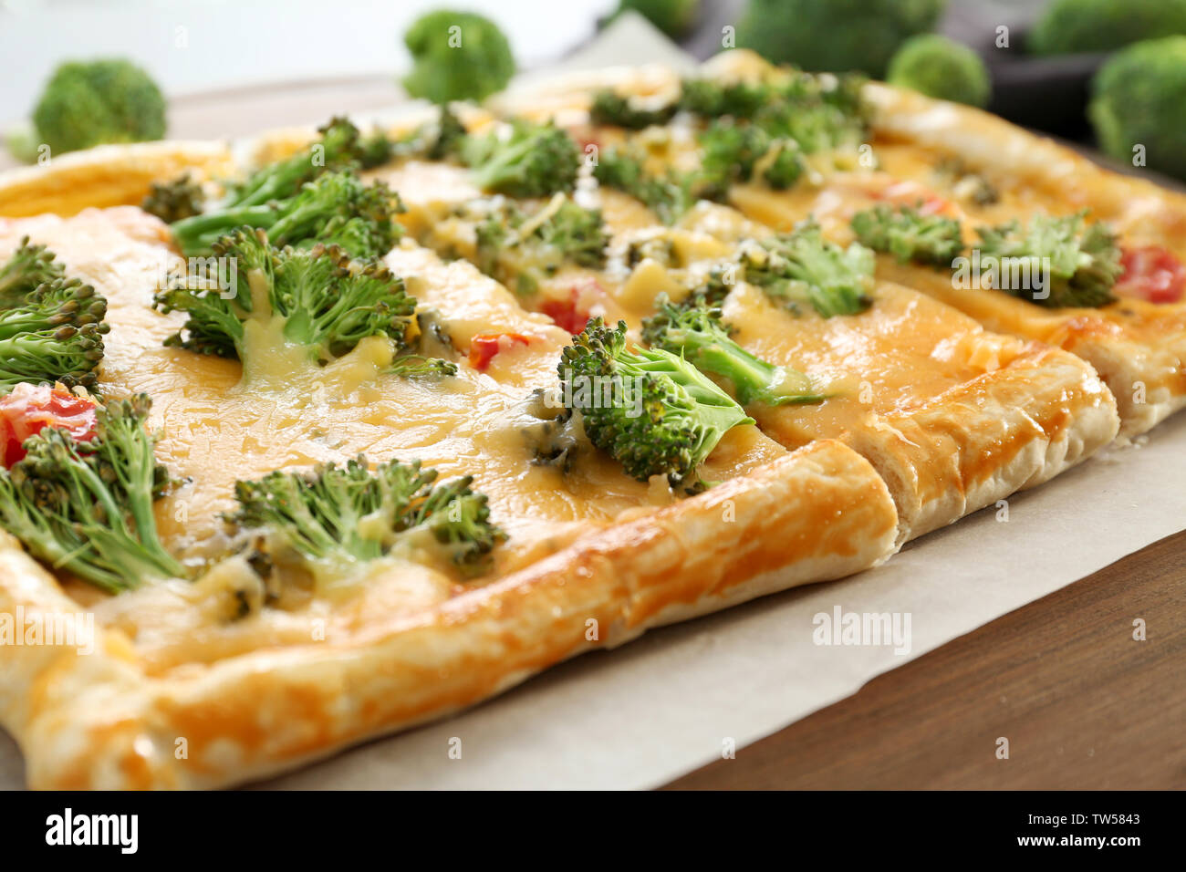 Traditional quiche with broccoli and cheese on board, close up Stock ...