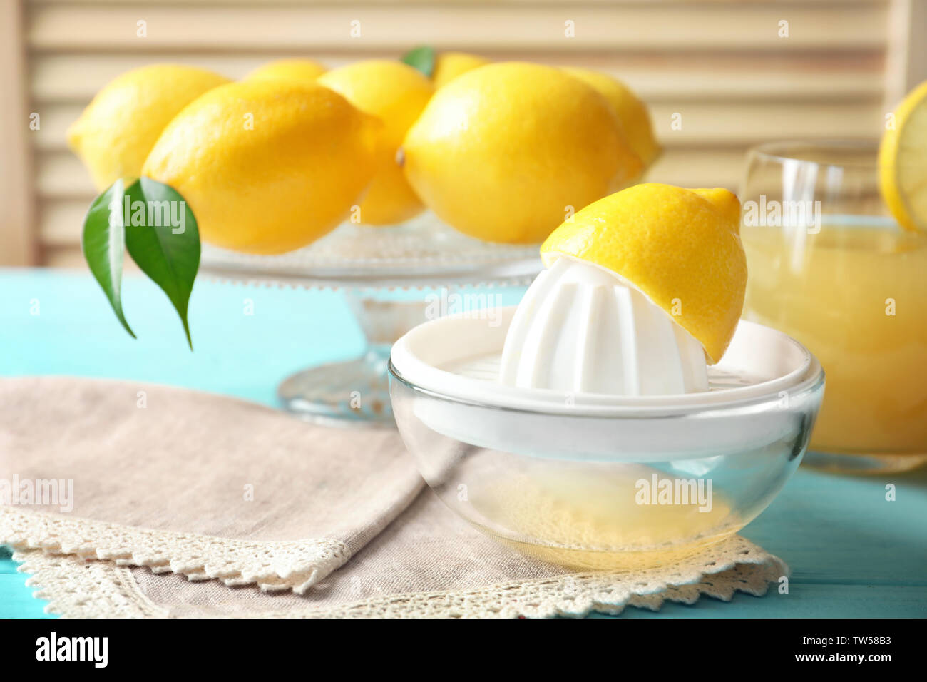 Lemon squeezer on table Stock Photo - Alamy