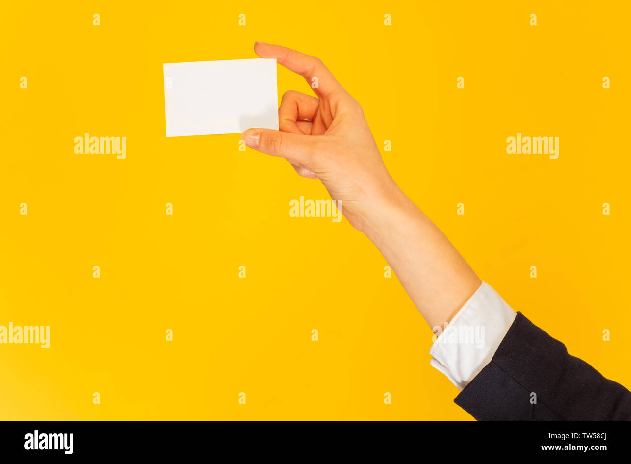 Woman's hand giving name card with copy space Stock Photo - Alamy