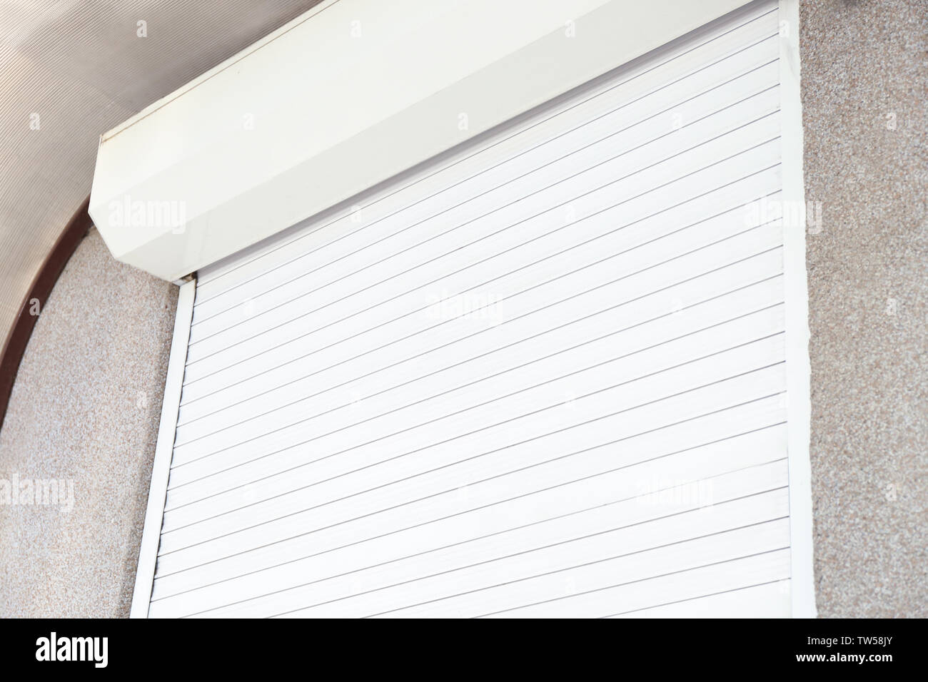 Window with closed roller shutter, closeup Stock Photo - Alamy