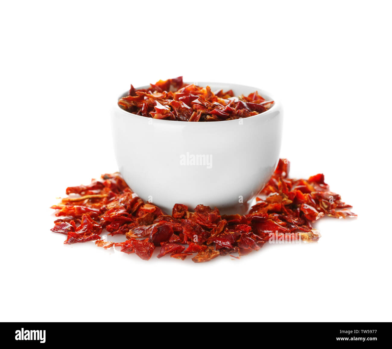 Red chili flakes in ceramic bowl isolated on white Stock Photo - Alamy