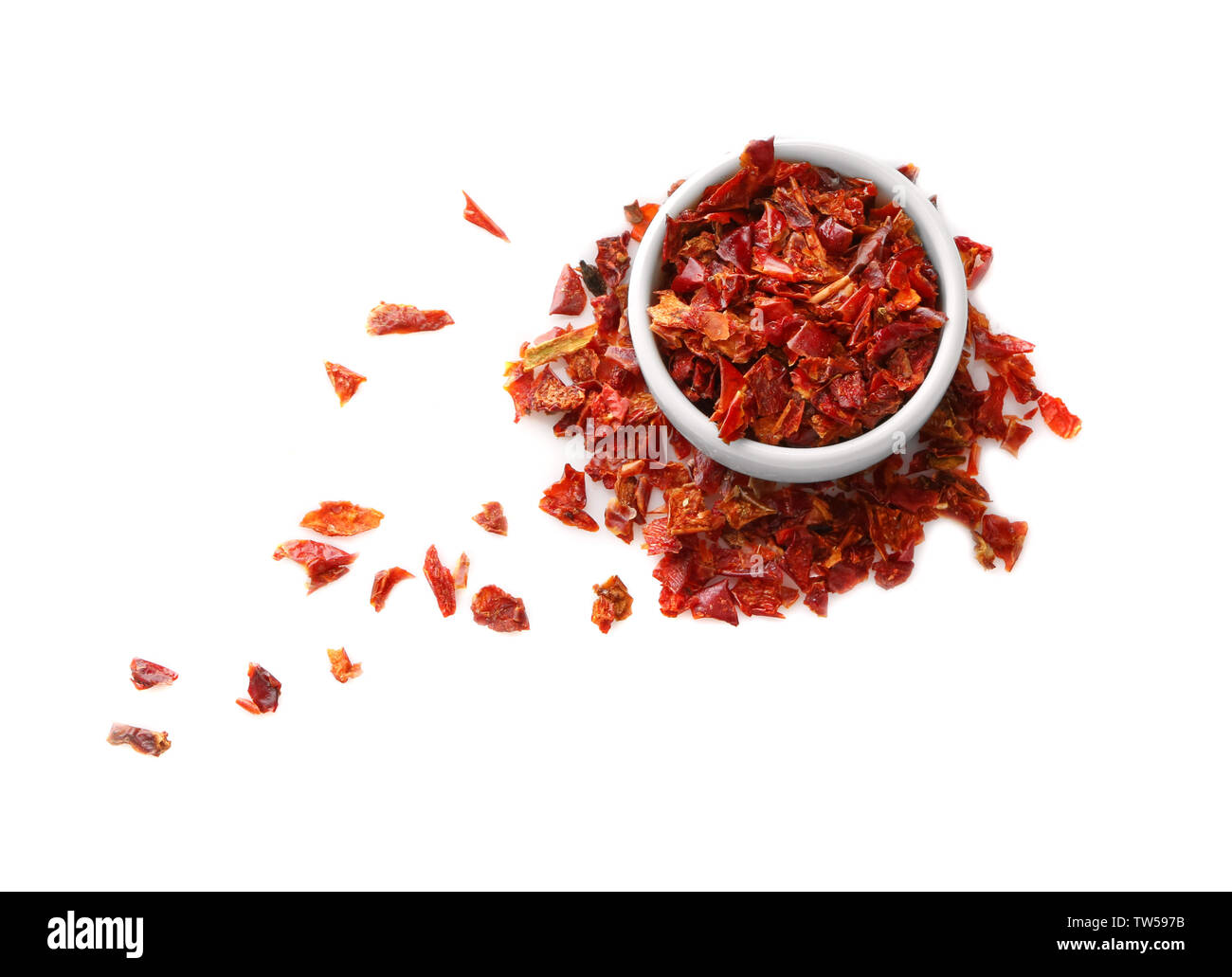 Red chili flakes in ceramic bowl isolated on white Stock Photo - Alamy