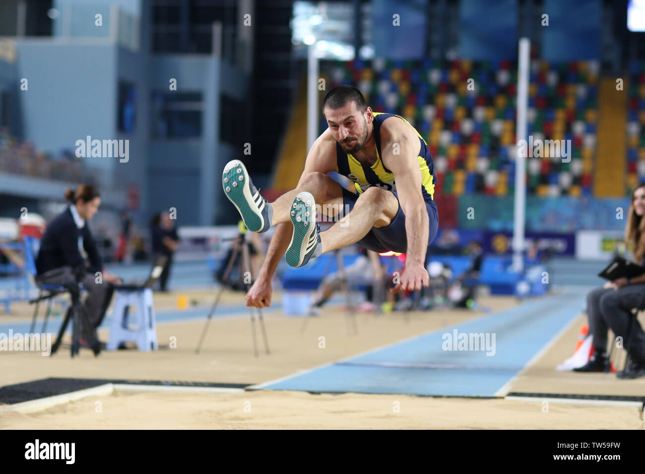ISTANBUL, TURKEY - FEBRUARY 02, 2019: Undefined athlete long jumping ...