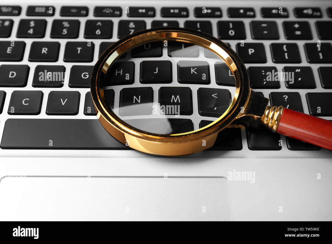 Magnifying glass on laptop. Internet search concept Stock Photo - Alamy