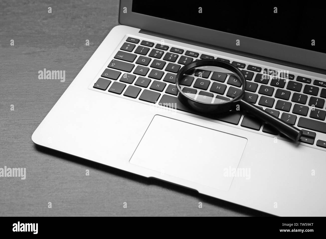 Magnifying glass on laptop. Internet search concept Stock Photo - Alamy