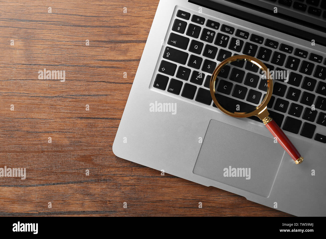 Magnifying glass on laptop. Internet search concept Stock Photo - Alamy