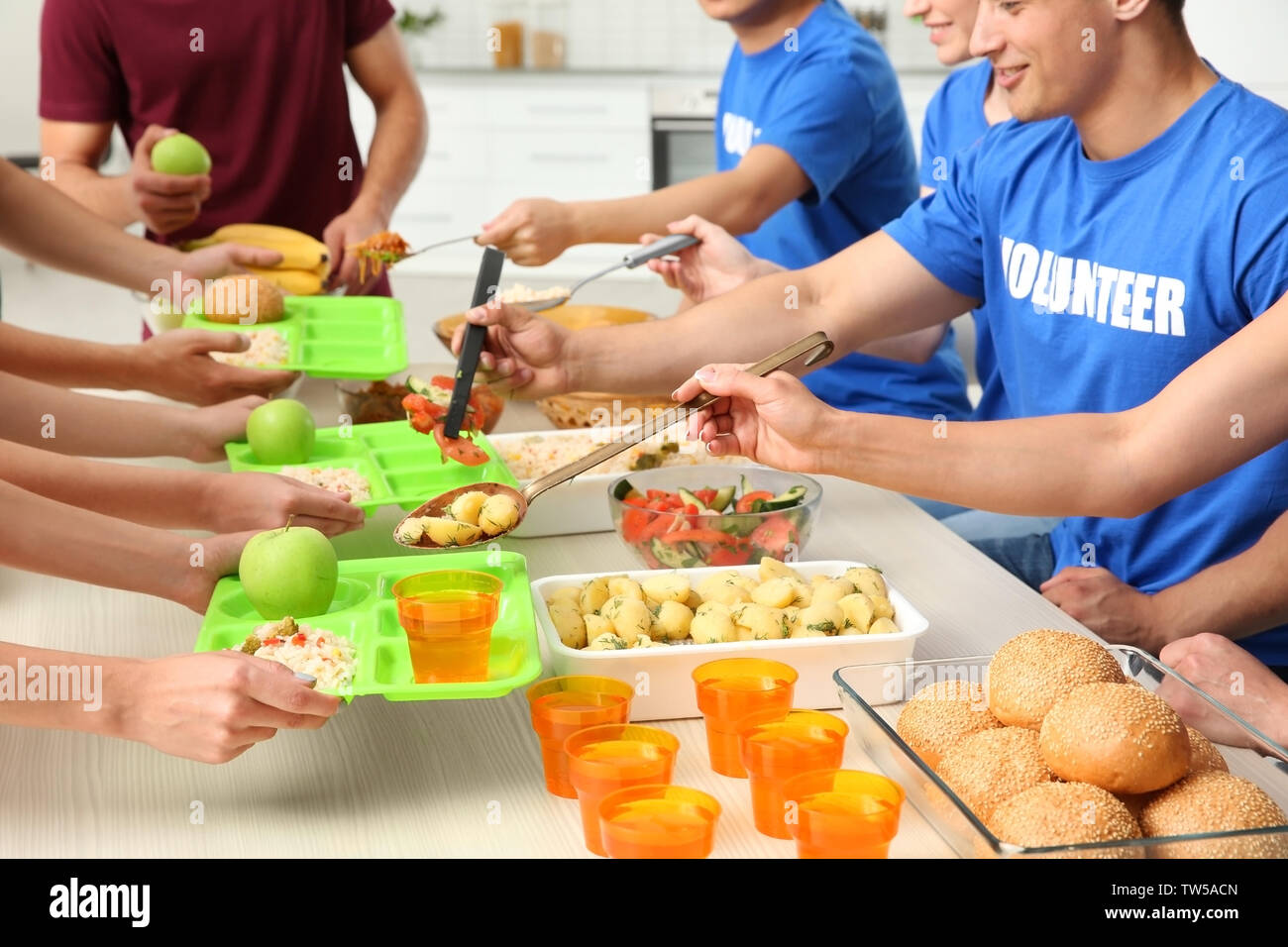 People Helping The Homeless With Food