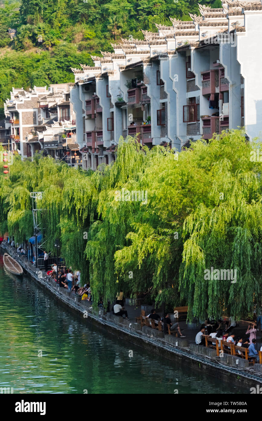Traditional houses along Wuyang River and Dragon Boat Race on the river ...