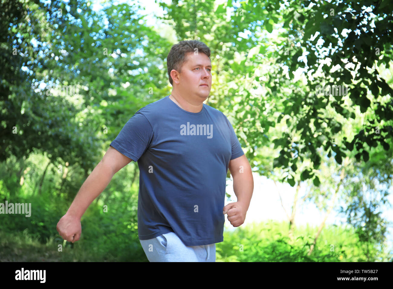 Overweight man running hi-res stock photography and images - Alamy
