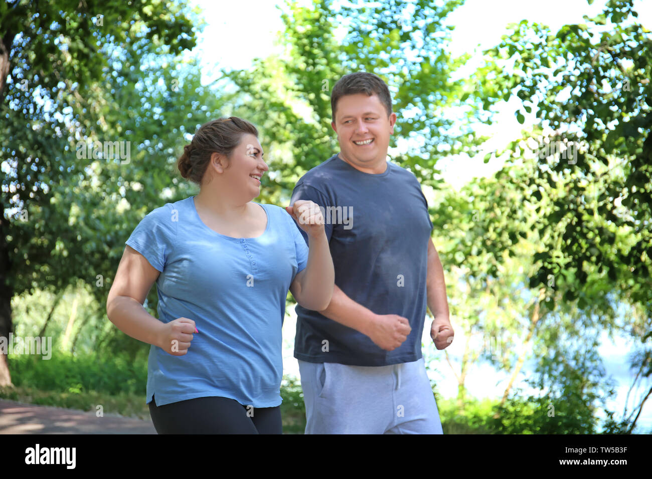 Big fat obese overweight couple people man woman hi-res stock ...