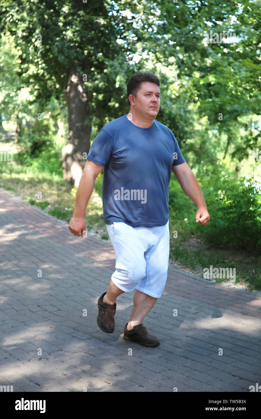 Overweight man running hi-res stock photography and images - Alamy