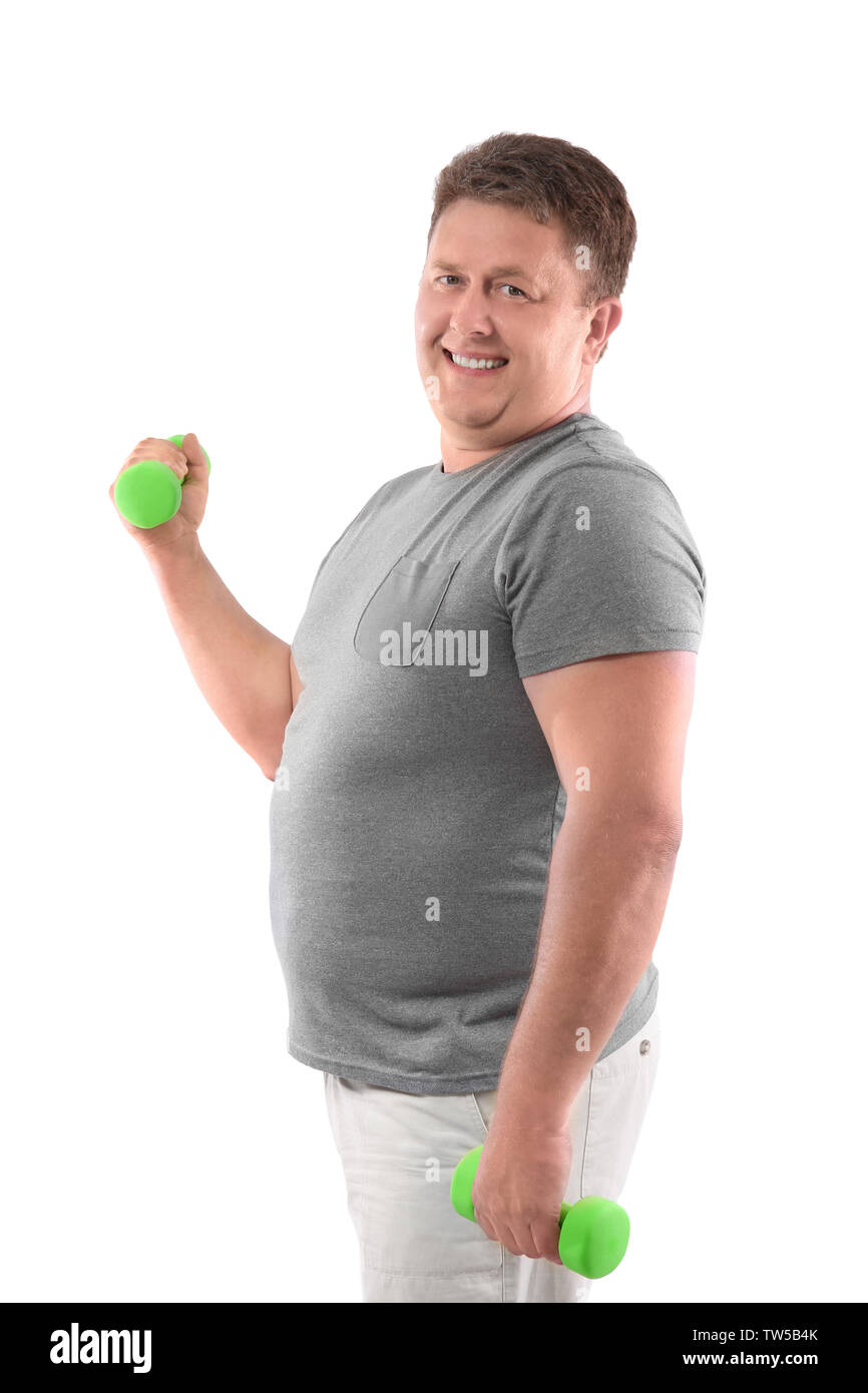 Overweight man training with dumbbells on white background Stock Photo ...