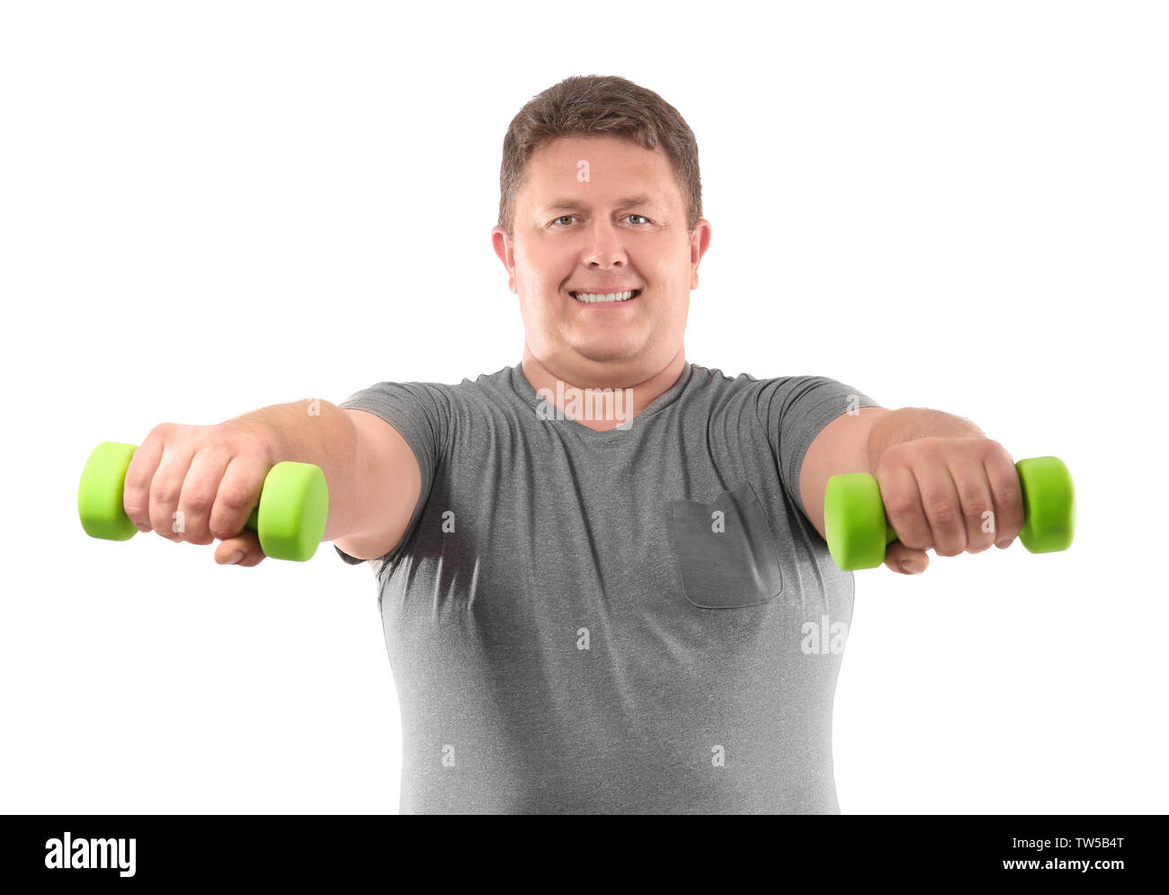 Overweight man with dumbbells on white background Stock Photo - Alamy