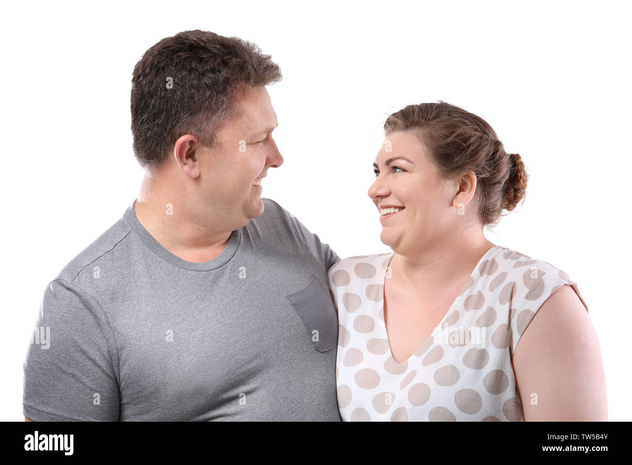 Overweight couple on white background Stock Photo - Alamy