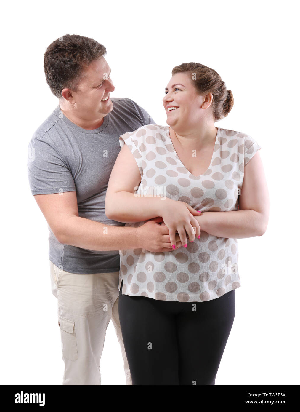 Overweight couple on white background Stock Photo - Alamy