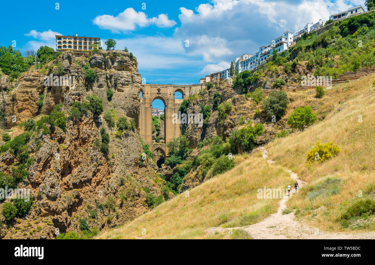 Ronda and its historic bridge on a summer day. Province of Malaga ...