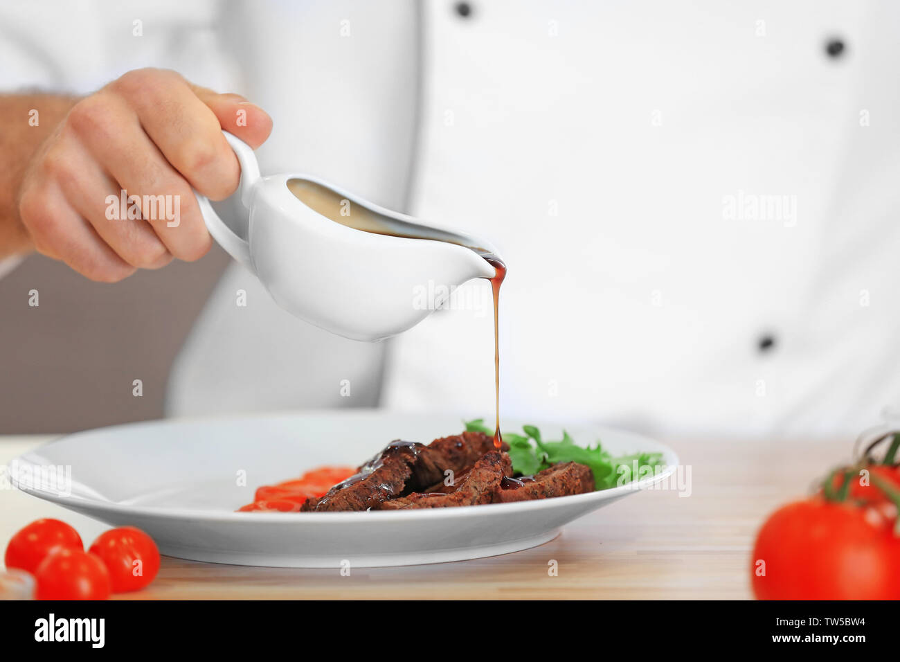 Hand young chef pouring hi-res stock photography and images - Alamy