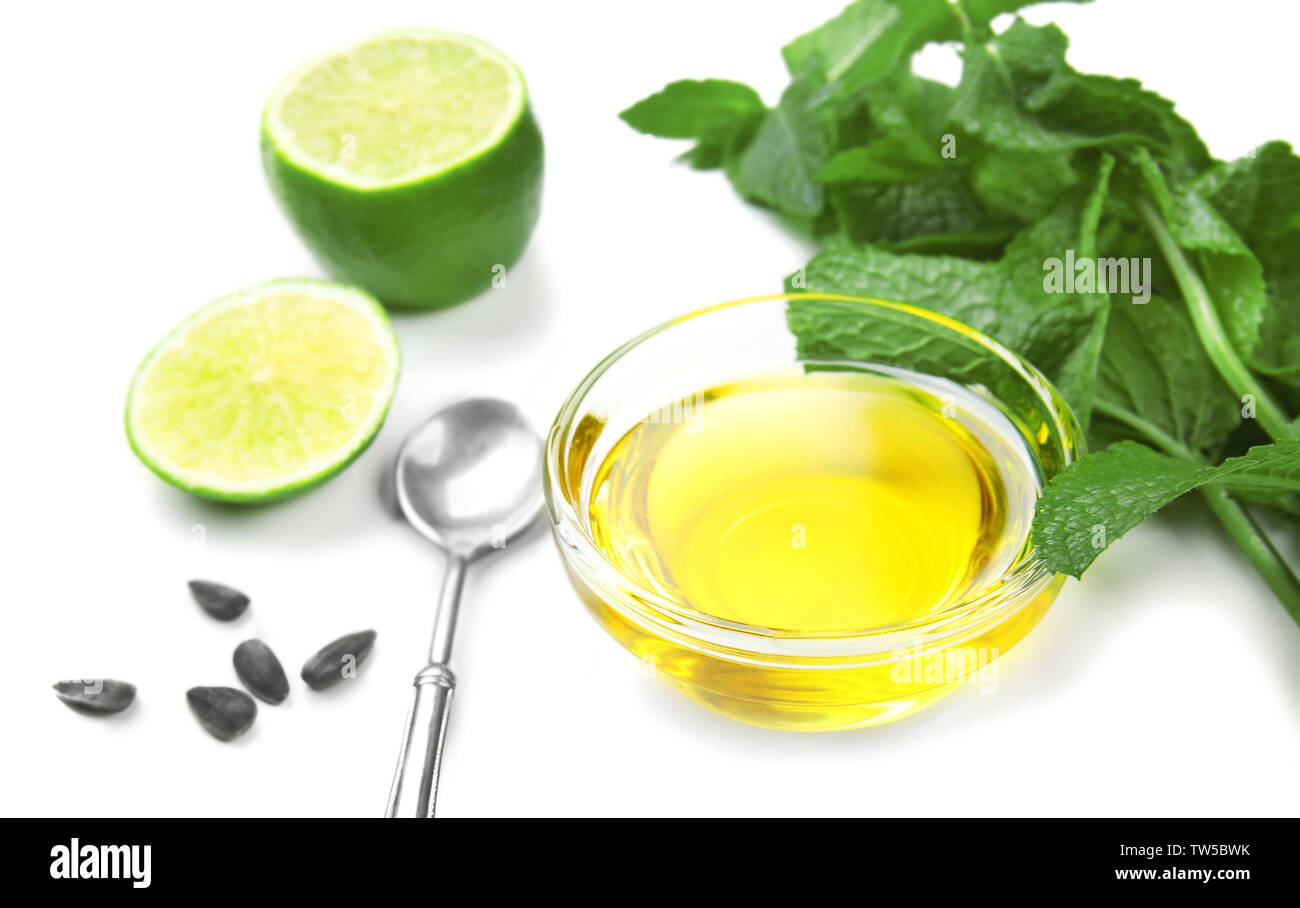 Composition with cooking oil and mint on white background Stock Photo ...