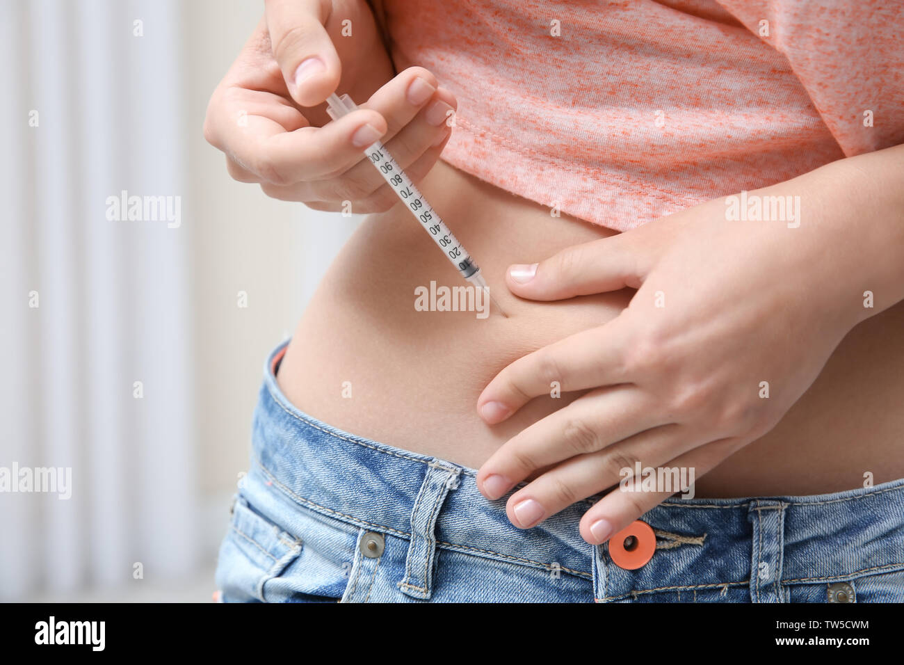 Diabetic patient injecting insulin in stomach, closeup Stock Photo - Alamy
