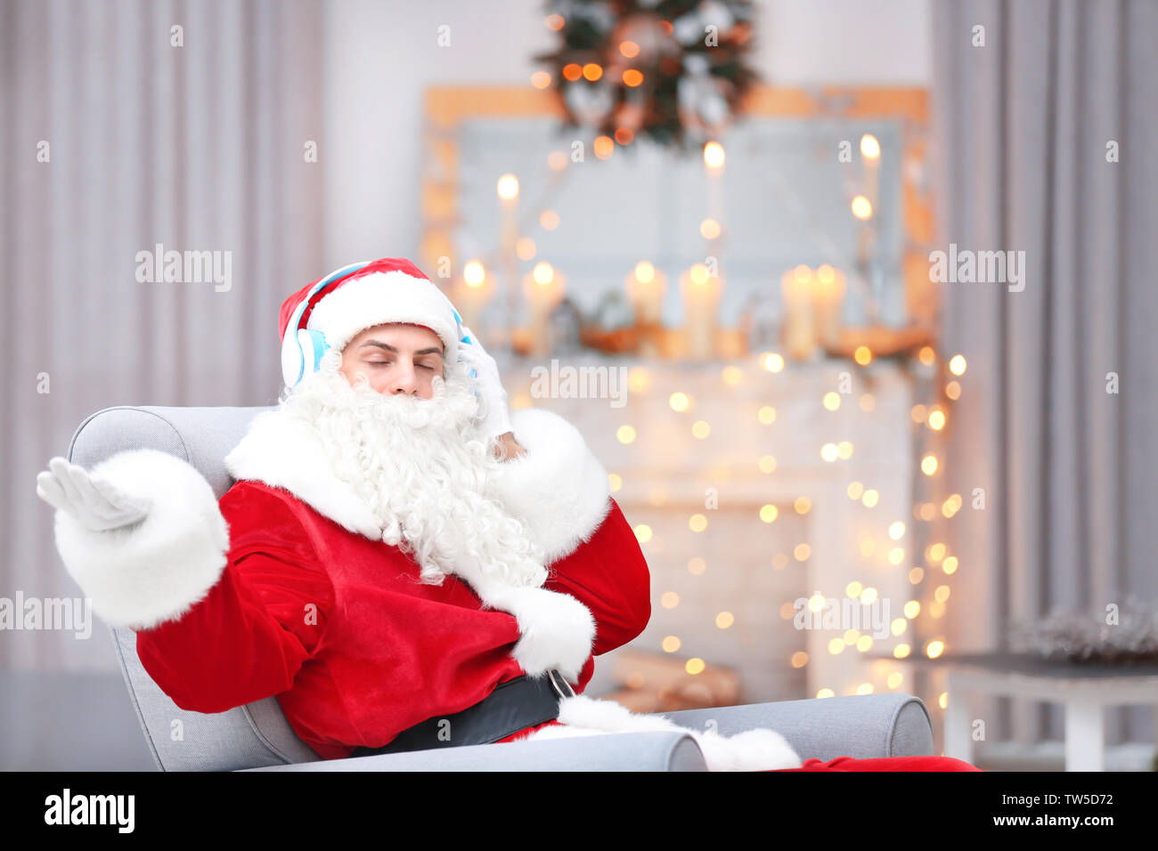 Modern santa claus listening christmas hi-res stock photography and ...