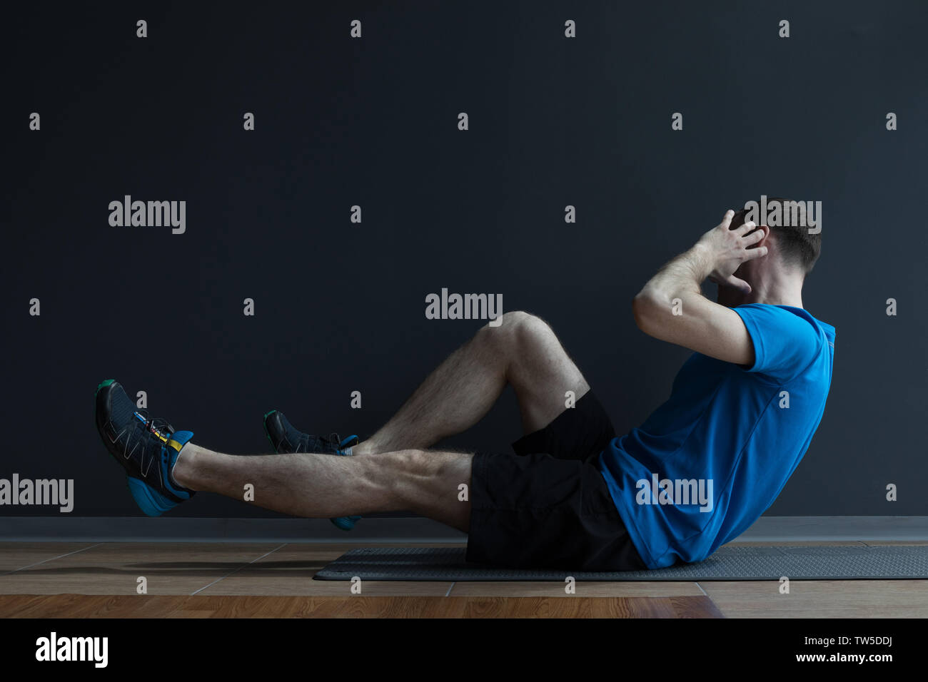 Man doing press exercises. Man oing abdominal exercises Stock Photo - Alamy
