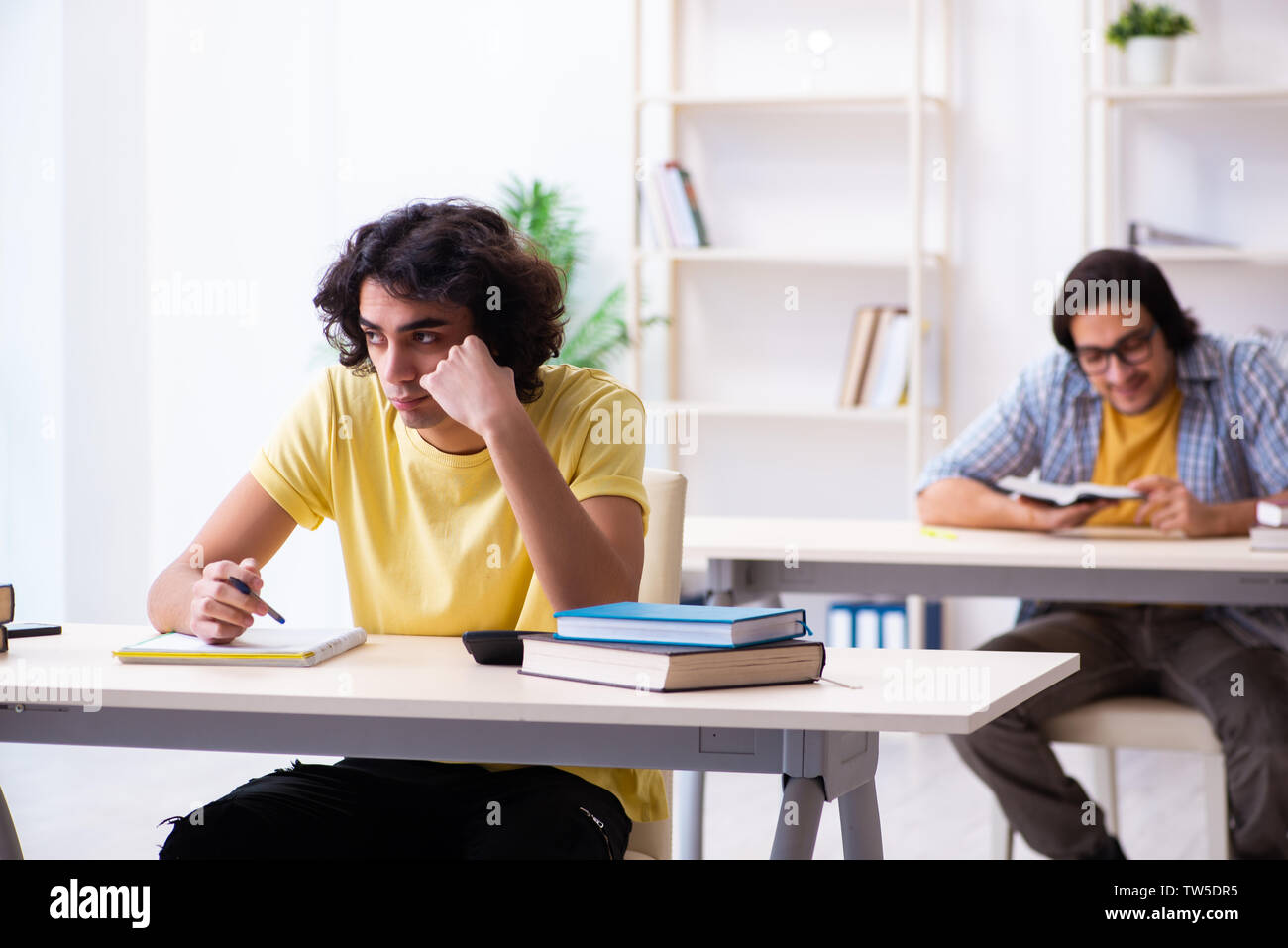 Two male students in the classroom Stock Photo - Alamy