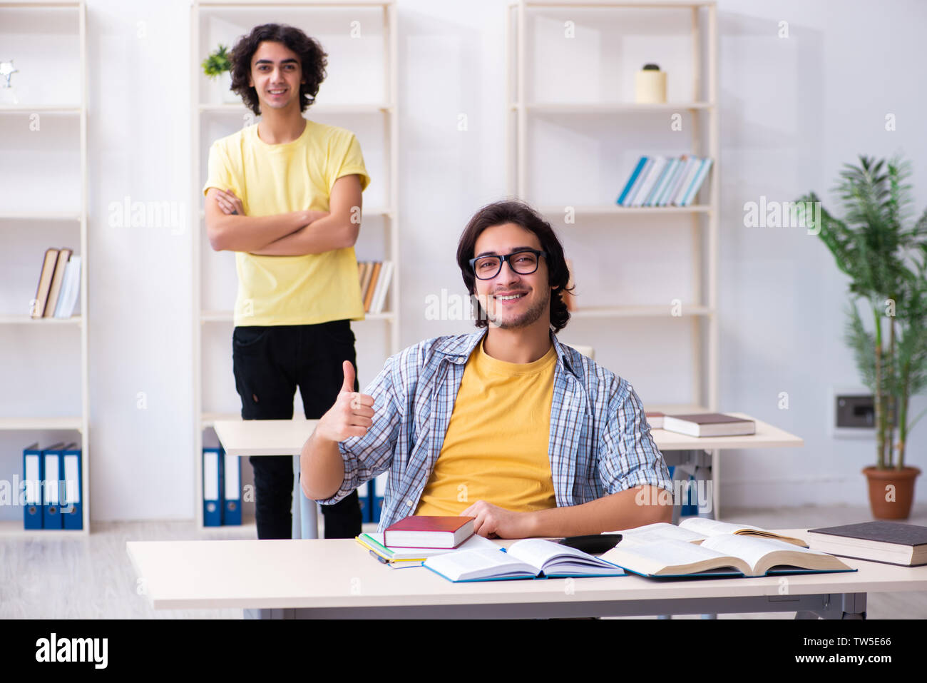 Two male students in the classroom Stock Photo - Alamy