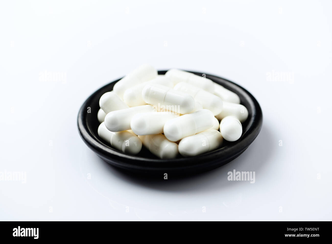 Creatine capsules. Bodybuilding food supplement on white background ...