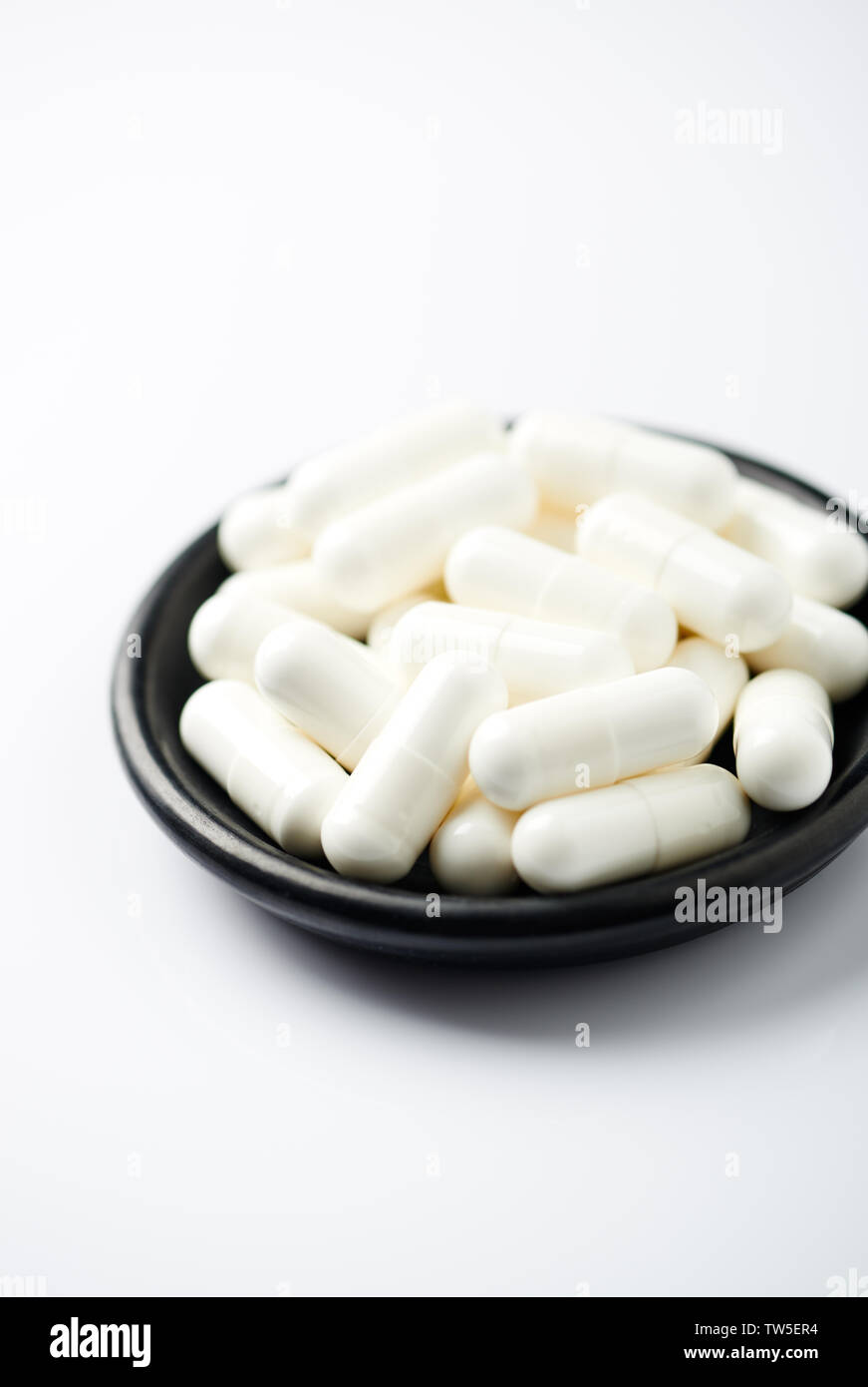 Creatine capsules. Bodybuilding food supplement on white background ...